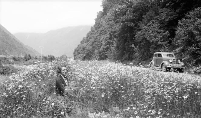 Ngaire Hooper sitting amongst the flowers, Otira Gorge.1940. | West ...